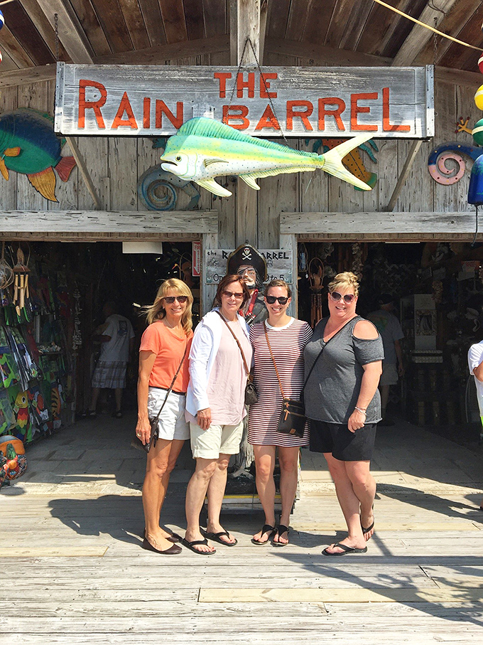 The Rain Barrel sign welcomes visitors with a colorful mahi-mahi that seems to say, "Yes, this place is exactly as fun as it looks."