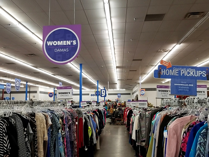 Under signs that guide but never rush, women's fashion awaits&mdash;dresses, blouses, and jackets organized with department store precision.