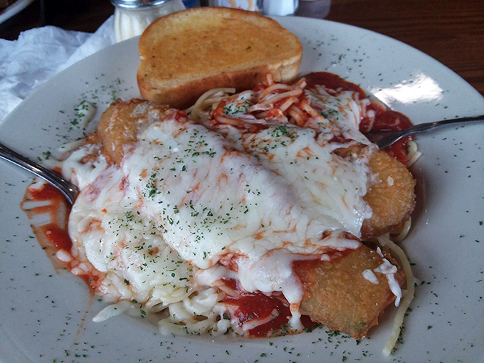 
Their chicken parmesan doesn't just sit on the plate&mdash;it lounges luxuriously on a bed of pasta, draped in melted cheese like it's posing for a portrait. 