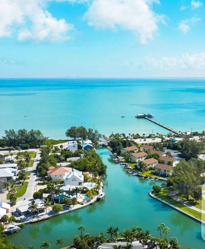 Anna Maria's canal-front living looks like someone spilled turquoise paint into a perfect neighborhood&mdash;where every house seems to have won the location lottery.