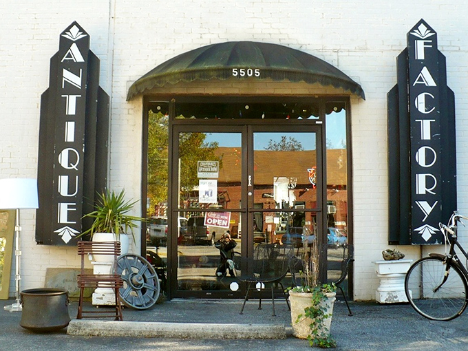 The Antique Factory's industrial storefront hints at unique finds and serious vintage shopping experiences.