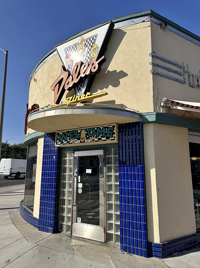 Art Deco curves and blue tiles create a dining experience that's as visually satisfying as the comfort food.
