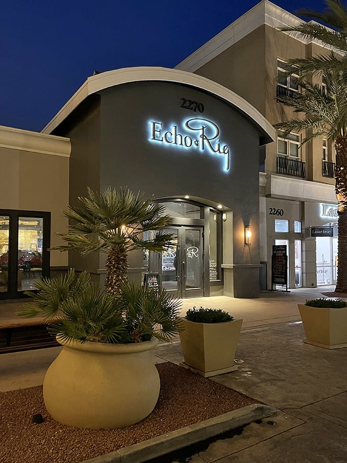 That elegant entrance and lush greenery hint at the butcher-fresh steaks waiting inside for you.