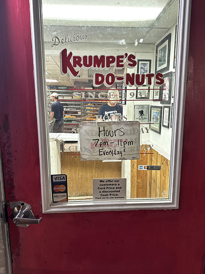 Krumpe's red door and handwritten hours sign hint at the old-school donut magic happening inside this Hagerstown institution.