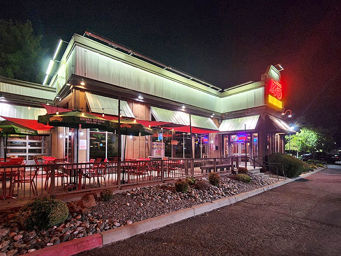 Logan's glowing neon sign cuts through the night, promising roadhouse comfort and serious steak satisfaction.