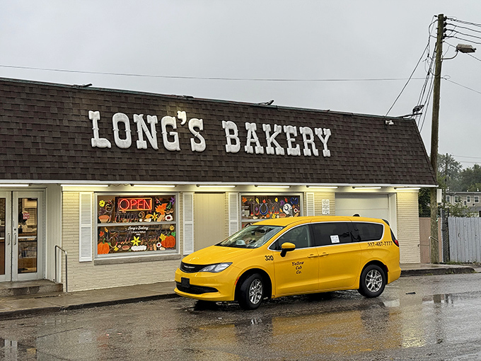 Long's Bakery's modest exterior belies the extraordinary treats within. That yellow taxi knows exactly where the good stuff is.