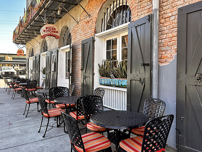 Louisiana Pizza Kitchen's French Quarter charm blends history with hunger satisfaction. Those outdoor tables aren't just seating&mdash;they're front-row tickets to New Orleans.