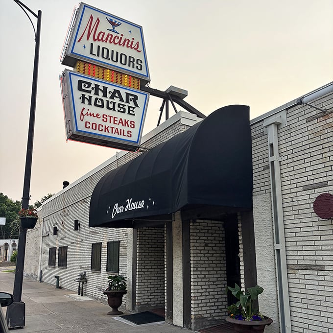Mancini's vintage sign isn't just nostalgic &ndash; it's a time machine to when steaks were serious business and cocktails had character.