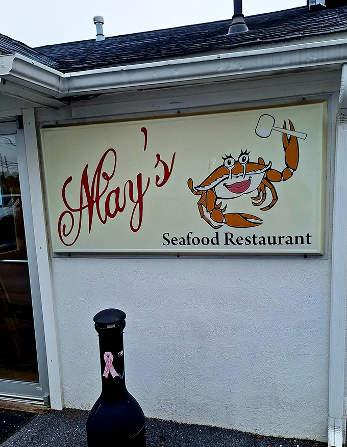 May's cheerful crab mascot waves hello. He seems suspiciously happy for someone working at a seafood restaurant.