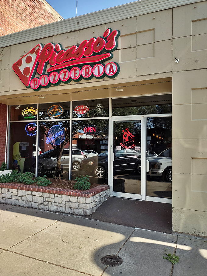 Picasso's Pizzeria's classic storefront promises artistry by the slice. Where pizza becomes a masterpiece!