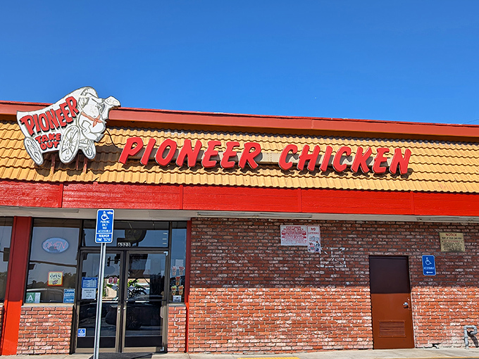 Pioneer Chicken's second location sports the same iconic orange-red color scheme &ndash; proving great taste never goes out of style.