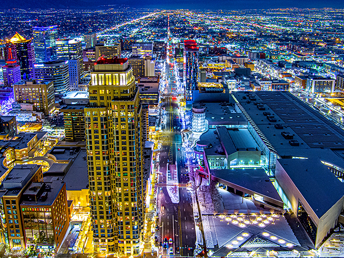 Salt Lake City lights up like a galaxy of earthbound stars at night. The city grid creates a dazzling pattern of human ingenuity.