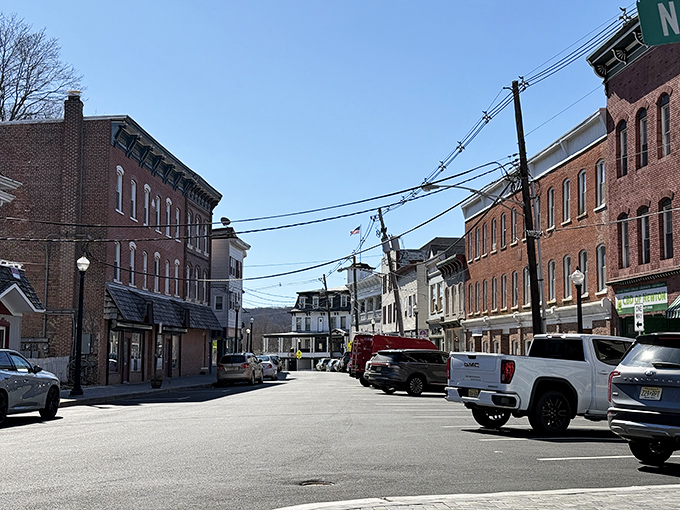 Sussex's main street stretches into the distance like a promise of simple living where budgets and happiness coexist.