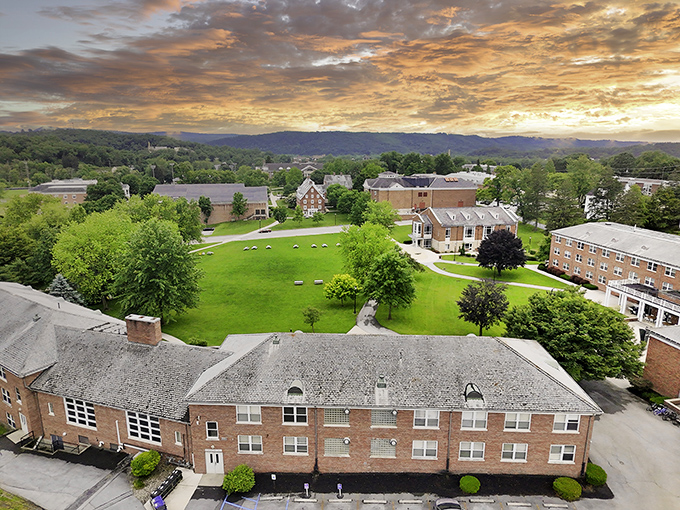 Sunset bathes Huntingdon's campus in golden light, highlighting educational opportunities that enrich retirement in this affordable community.