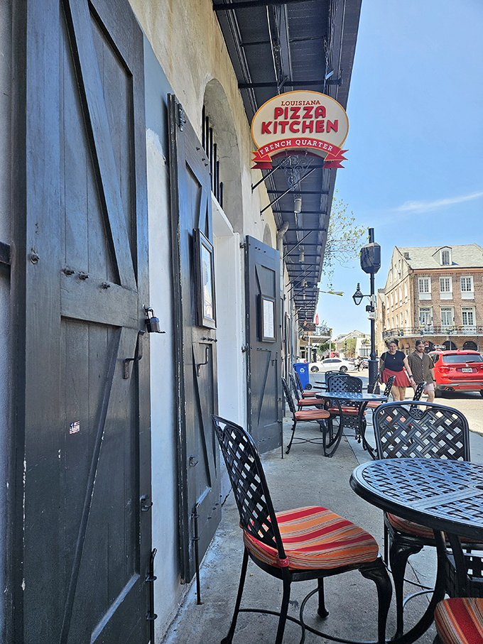 The historic facade and inviting entrance of Louisiana Pizza Kitchen whisper of pizza with personality. In the French Quarter, even the pizza has stories to tell.