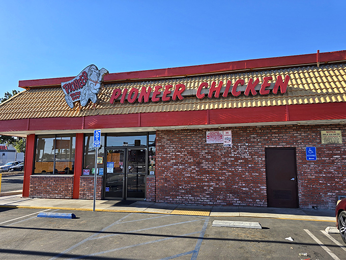 The classic Pioneer Chicken sign stands tall against the blue California sky &ndash; a landmark for fried chicken pilgrims everywhere.