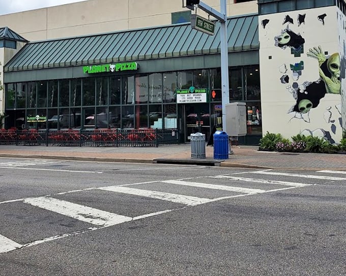 That cheeky sign at Planet Pizza promising "You bet Uranus its good" tells you they take their pizza seriously, not themselves.