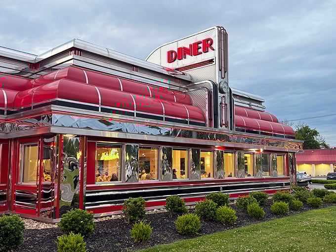 As evening approaches, Sunliner's vintage-inspired architecture and bold signage light up the Pigeon Forge parkway.