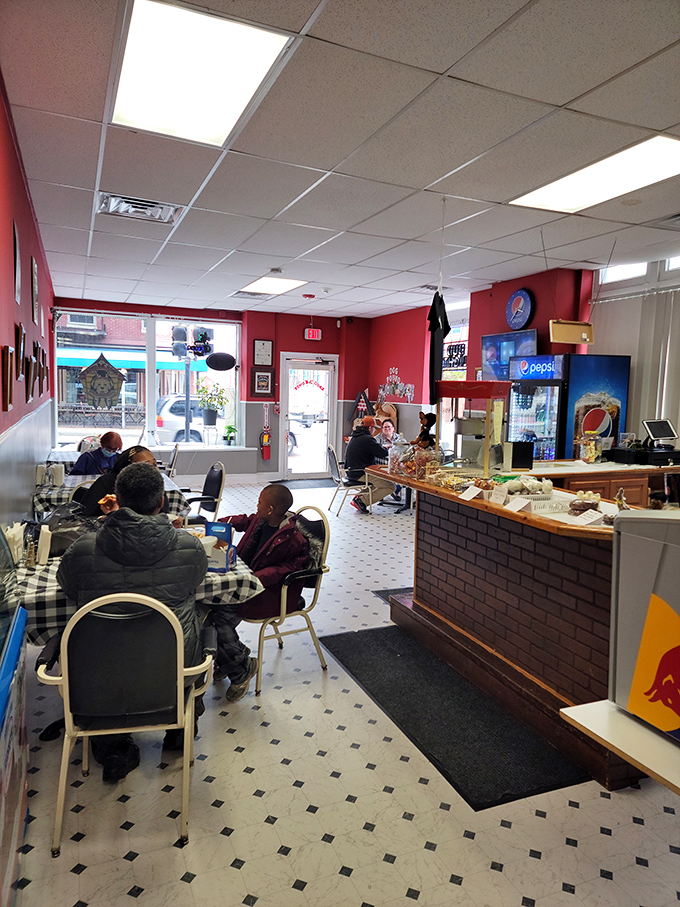 Inside The Dog House, comfort food reigns supreme in a cozy atmosphere where regulars and newcomers alike gather for hot dog perfection.