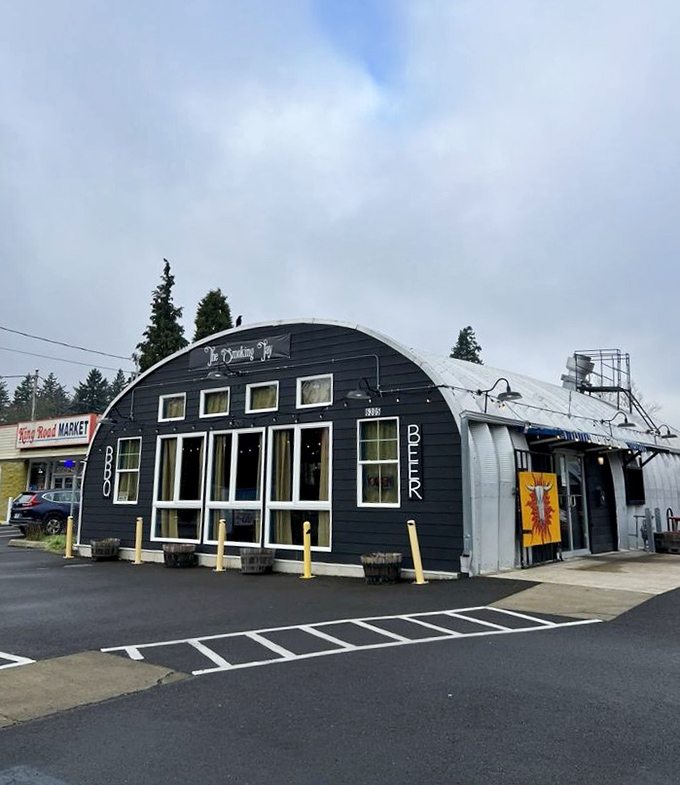 Part airplane hangar, part BBQ paradise. The Smoking Jay's distinctive black exterior with white trim promises unique flavors inside.