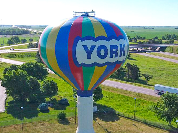 This giant water tower balloon serves as a whimsical landmark that perfectly captures the town's playful spirit and community pride.