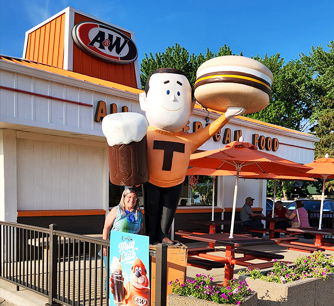 The A&W Restaurant's iconic mascot holds up a burger with the same pride Emmetsburg holds up its affordable living standards.
