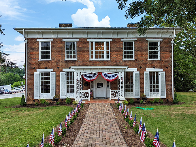 American flags line the brick pathway to this stately historic home. Its symmetrical Federal-style architecture speaks to Abingdon's deep roots in American history.