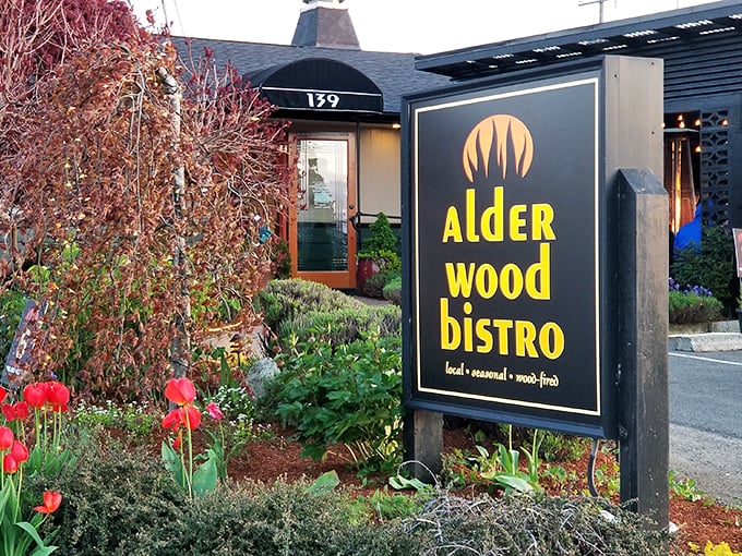 Alder Wood Bistro's garden entrance feels like stumbling into a secret culinary hideaway that locals wish tourists wouldn't discover.