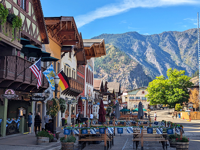 Colorful buildings with wooden balconies line the street, their facades competing for attention like contestants in a "Most Bavarian" pageant.