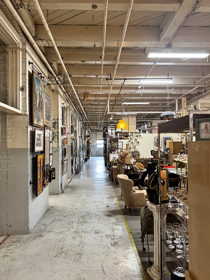 Industrial charm meets vintage treasure in these wide aisles where exposed pipes and brick create the perfect backdrop for antiquing adventures.