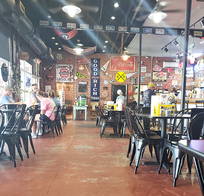 License plates on brick walls tell stories of travelers who came for gas, stayed for grouper. The concrete floor has heard it all.