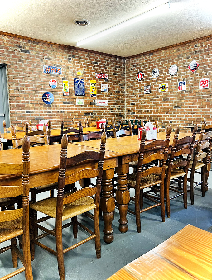 Wood-paneled walls adorned with vintage signs create the perfect backdrop for serious barbecue contemplation. No distractions from the main event.