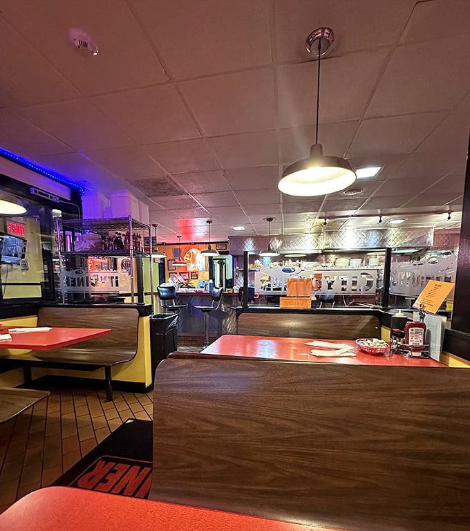 Red tables, yellow walls, and the soft glow of pendant lights create the perfect stage for the main event: your imminent food coma.