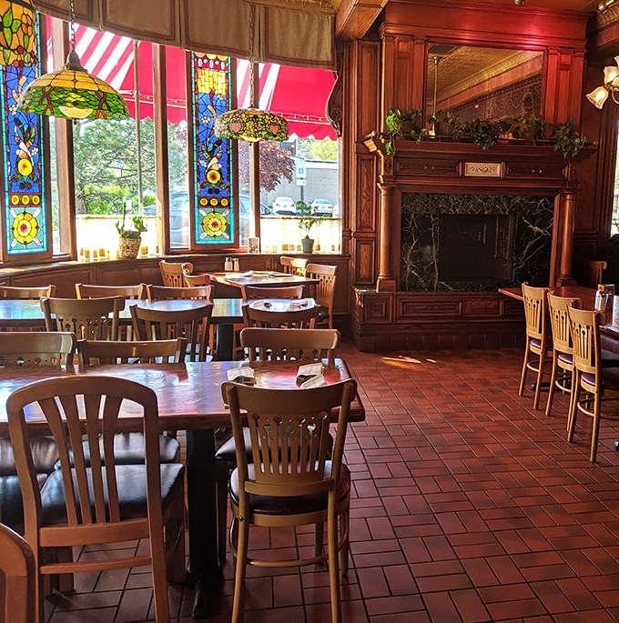 Sunlight streams through stained glass windows, casting colorful patterns across wooden tables where breakfast dreams come true.