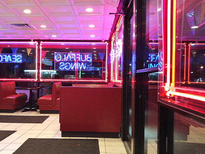 The evening glow transforms this corner spot into something from a neon-noir film&mdash;if that film was about really good chicken.