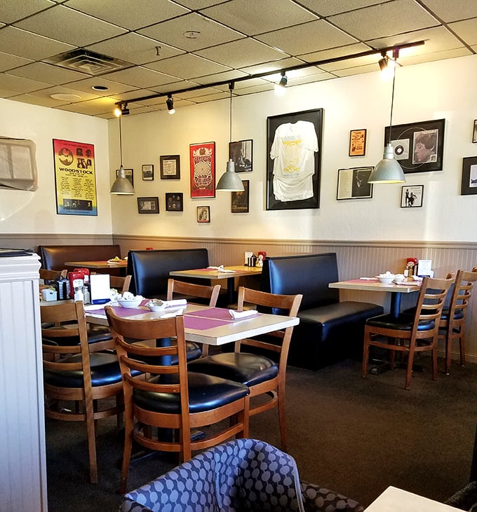 Wooden booths worn smooth by decades of elbows and conversations. The walls tell stories through memorabilia that feels earned, not manufactured.
