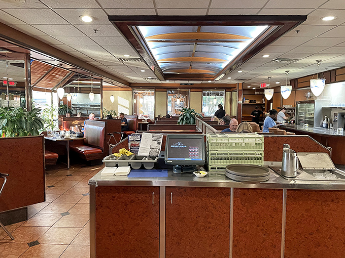 The interior balances classic diner charm with unexpected elegance. Where else can you get a milkshake while sitting in what feels like your successful friend's dining room?