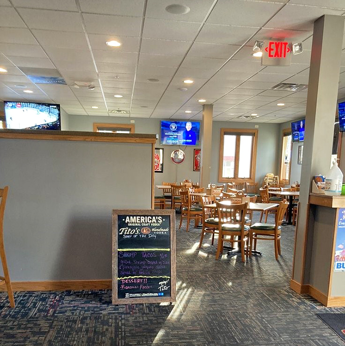 The dining area strikes that perfect balance between "nice enough for date night" and "casual enough for Tuesday lunch." Sports on TV, comfort on plates.