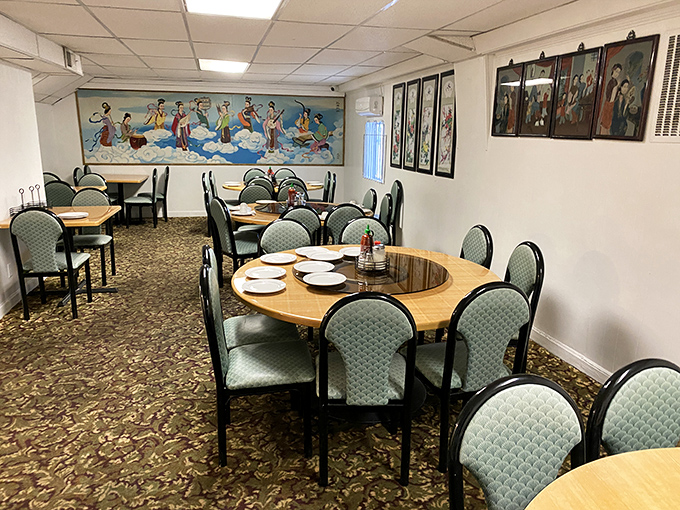 Another dining area offers a quieter experience with traditional artwork. The round tables practically demand family-style ordering&mdash;resistance is deliciously futile.