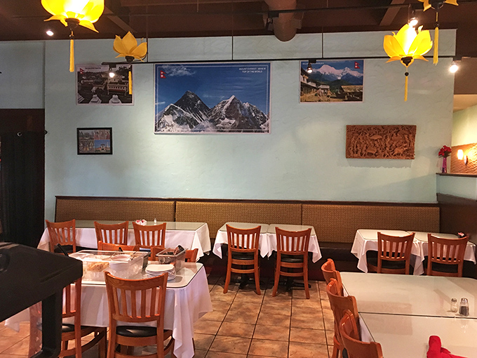 Another angle reveals the dining room's thoughtful simplicity. Those lotus lights aren't just illuminating the space—they're blessing your meal.