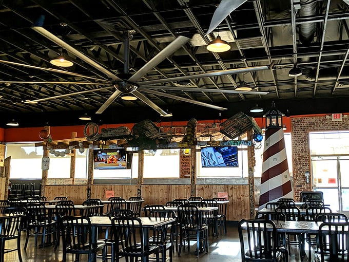 Wooden decor covered in customer signatures transforms dining tables into an interactive guest book that celebrates every messy meal shared.