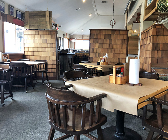 Cedar shake walls and captain's chairs create the perfect maritime atmosphere. You half expect a salty sea captain to walk in and start telling tales of the deep.