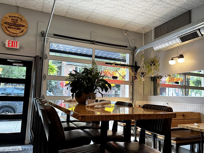 Sunlight streams through windows illuminating wooden tables where memories are made between bites of exceptional food.