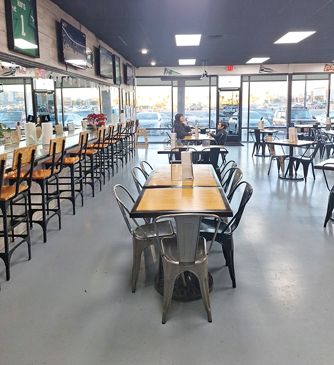 The dining area balances efficiency with comfort &ndash; metal chairs and wooden tables creating a space where the food, not the furniture, takes center stage.