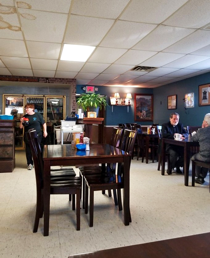 Blue walls, wooden tables, and the gentle hum of conversation—a dining room that feels more like home than a restaurant.