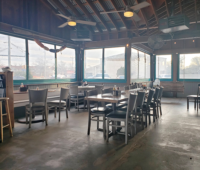 Sunlight streams through windows in this airy dining space. The perfect setting for lingering conversations over the last bites of seafood.