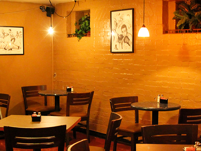 Mustard-yellow walls and pendant lighting create the kind of cozy ambiance that makes you want to linger over one more bite.