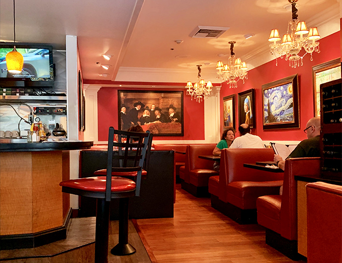 Red walls, leather booths, and chandeliers create an atmosphere that says, "Yes, hash browns can be served with a side of elegance."