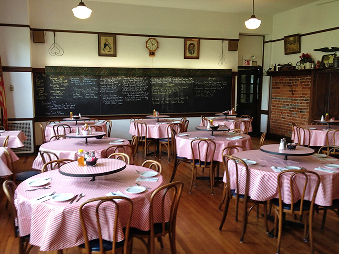 Pink checkered tablecloths and bentwood chairs create a classroom of culinary delights, with the blackboard still commanding attention after all these years.
