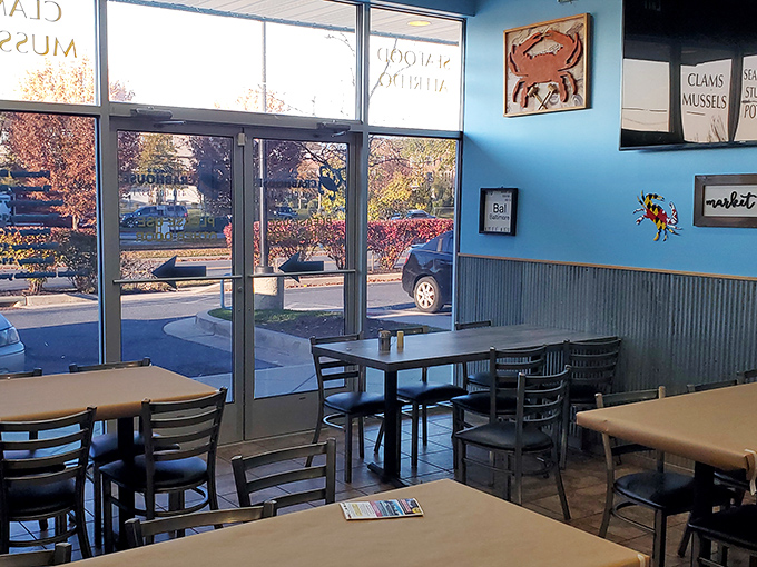 Simple tables, bright windows, and that signature blue wall&mdash;the dining area promises zero pretension and 100% focus on the food.